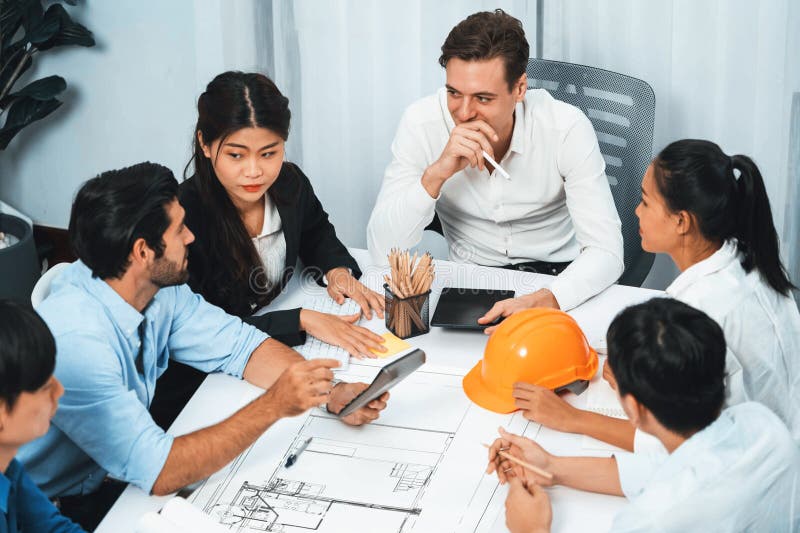 Diverse Group of Civil Engineer and Client Working on Architect ...
