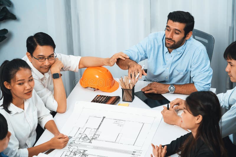 Diverse Group of Civil Engineer and Client Working on Architect ...