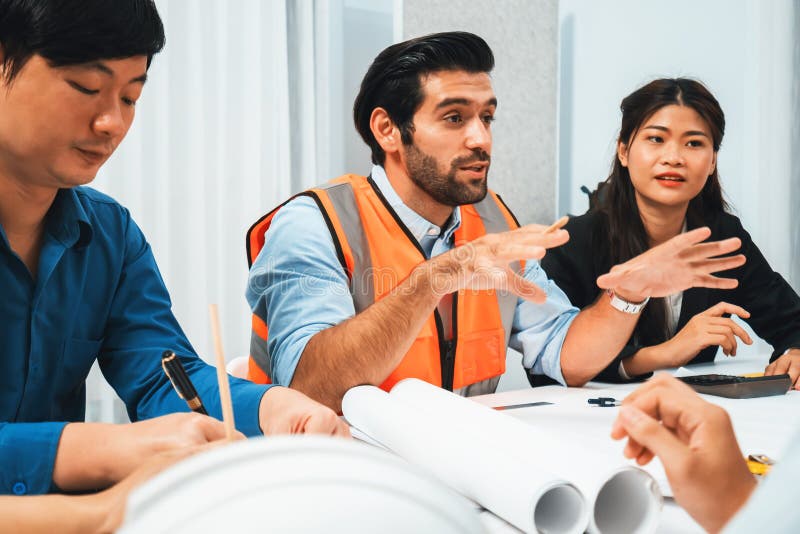 Diverse Group of Civil Engineer and Client Working on Architect ...