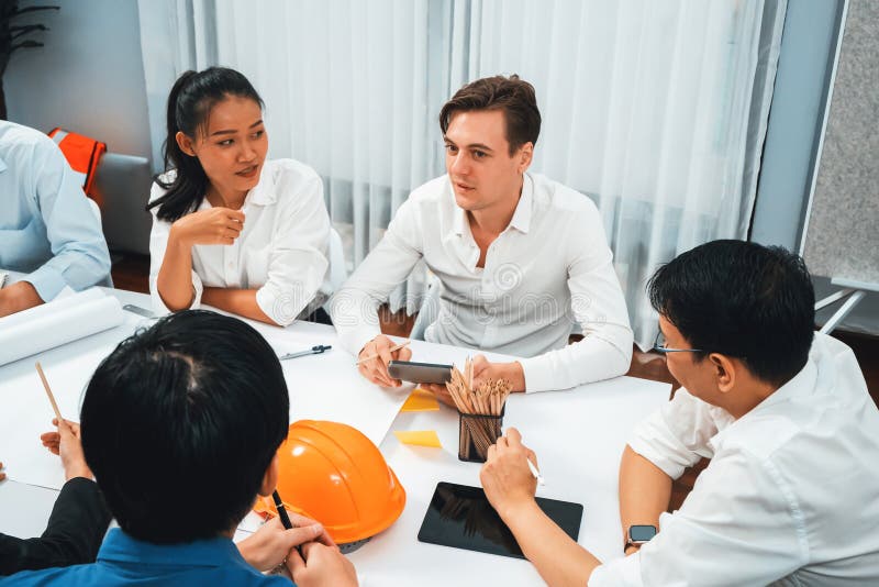 Diverse Group of Civil Engineer and Client Working on Architect ...