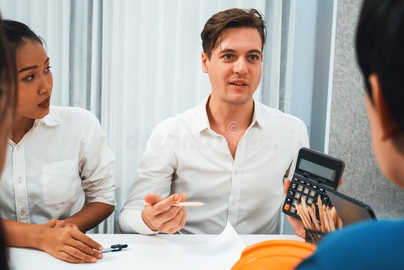 Diverse Group of Civil Engineer and Client Working on Architect ...