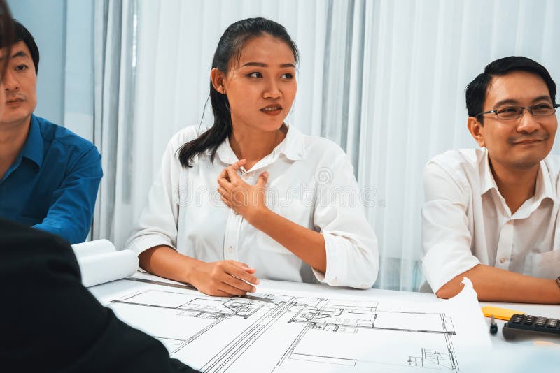 Diverse Group of Civil Engineer and Client Working on Architect ...