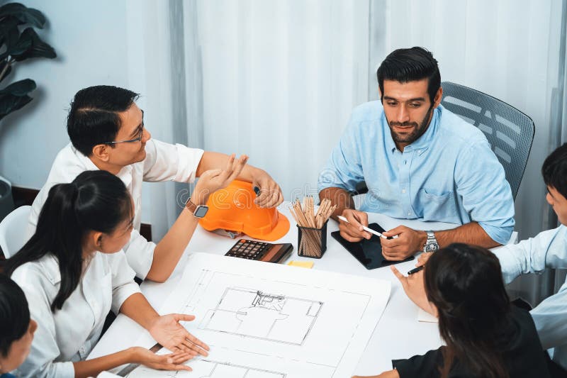 Diverse Group of Civil Engineer and Client Working on Architect ...