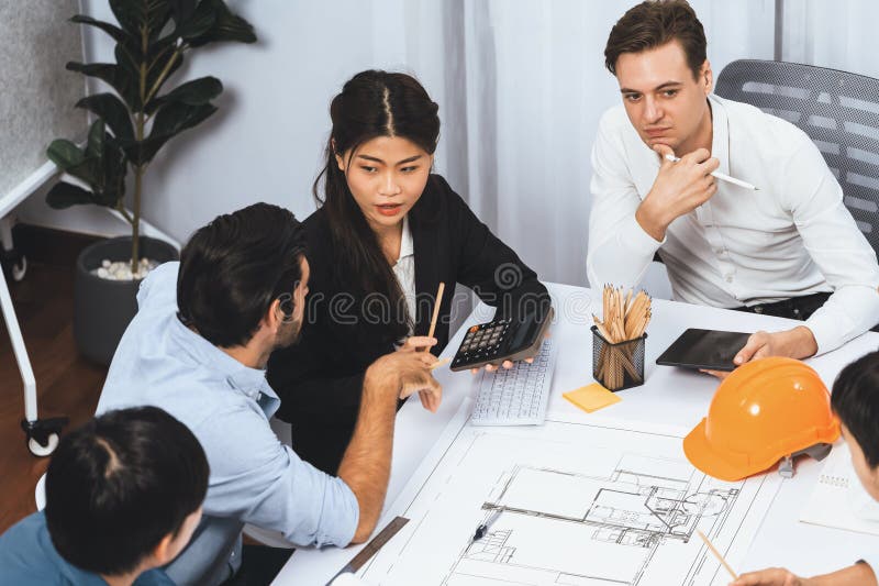 Diverse Group of Civil Engineer and Client Working on Architect ...