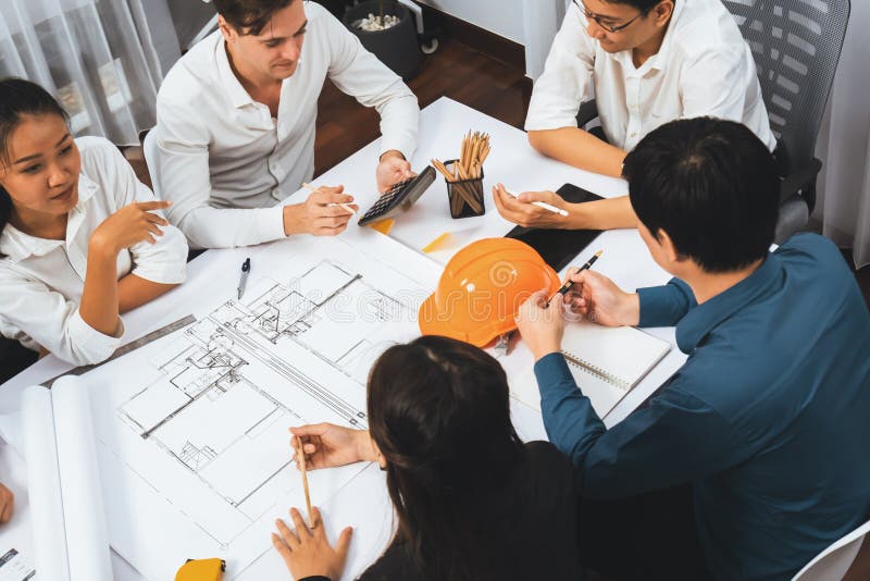 Diverse Group of Civil Engineer and Client Working on Architect ...