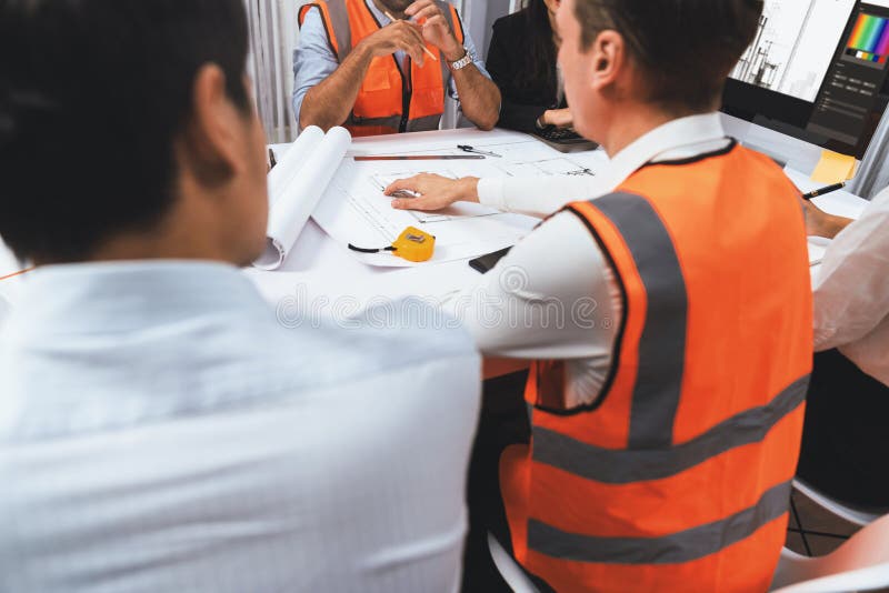 Diverse Group of Civil Engineer and Client Working on Architect ...