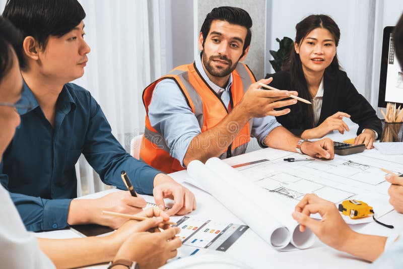 Diverse Group of Civil Engineer and Client Working on Architect ...
