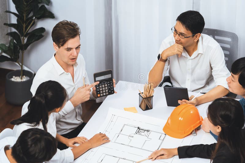 Diverse Group of Civil Engineer and Client Working on Architect ...