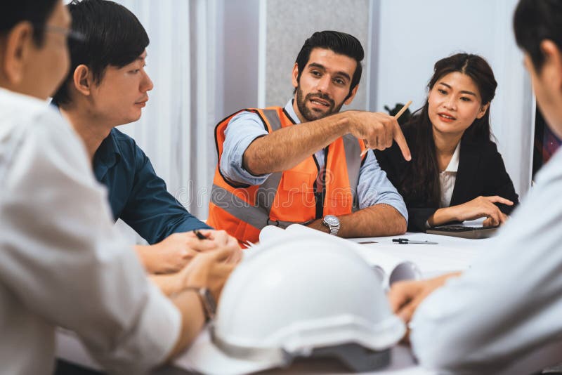 Diverse Group of Civil Engineer and Client Working on Architect ...
