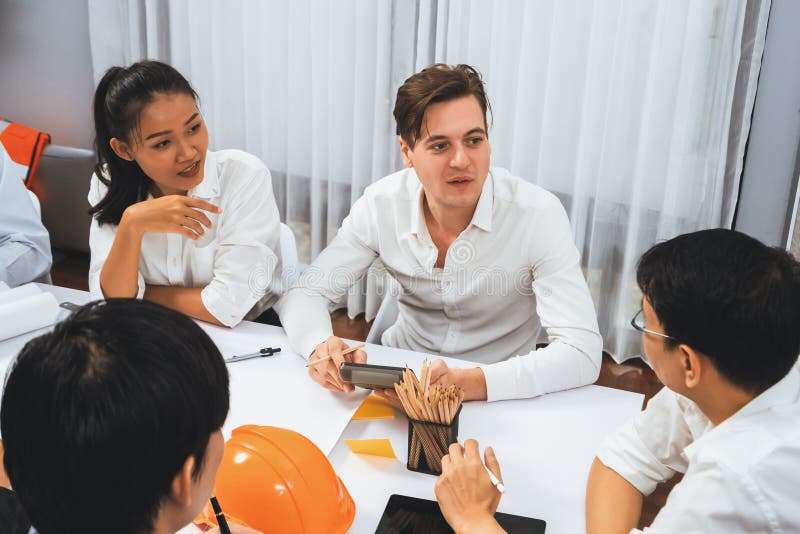 Diverse Group of Civil Engineer and Client Working on Architect ...