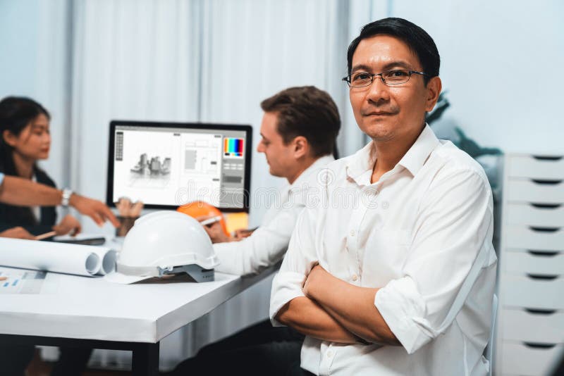 Diverse Group of Civil Engineer and Client Working on Architect ...