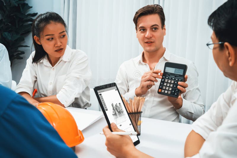 Diverse Group of Civil Engineer and Client Working on Architect ...