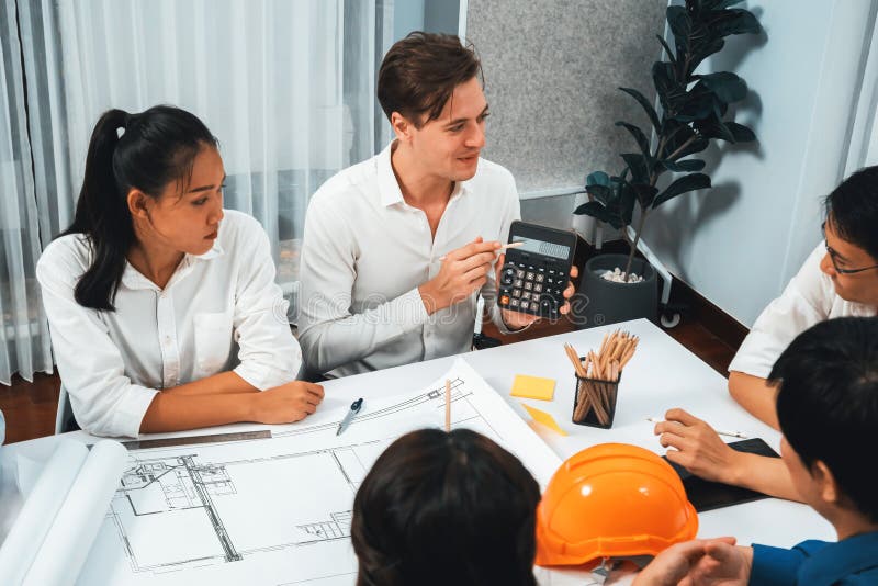 Diverse Group of Civil Engineer and Client Working on Architect ...