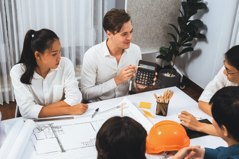 Diverse Group of Civil Engineer and Client Working on Architect ...