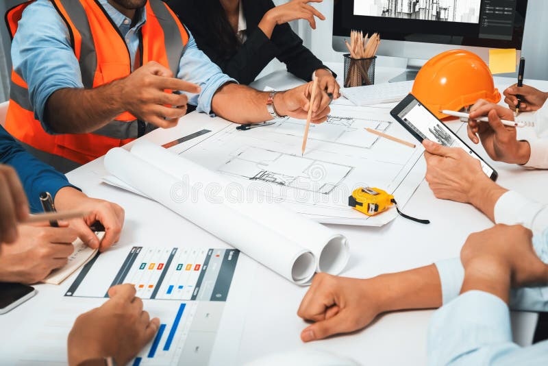 Diverse Group of Civil Engineer and Client Working on Architect ...