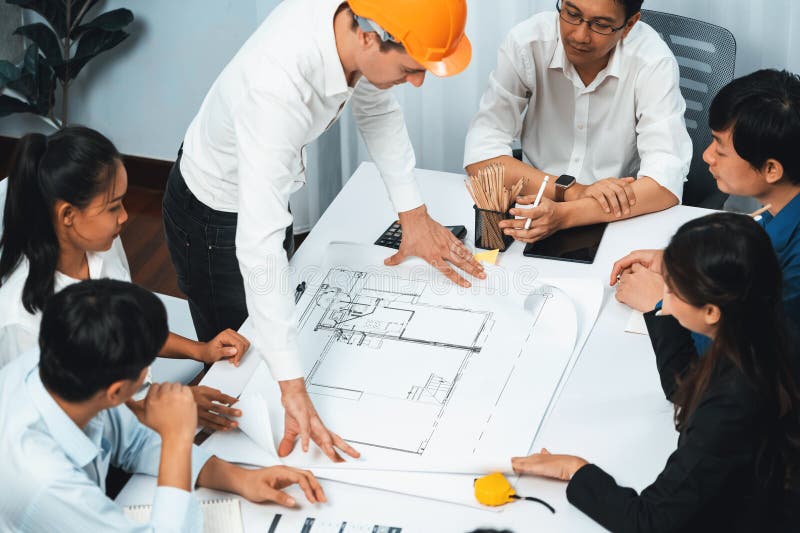 Diverse Group of Civil Engineer and Client Working on Architect ...