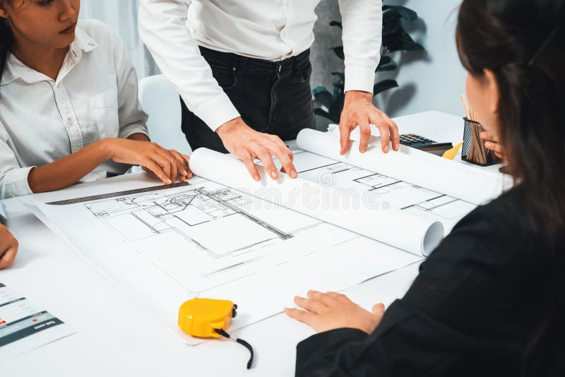 Diverse Group of Civil Engineer and Client Working on Architect ...