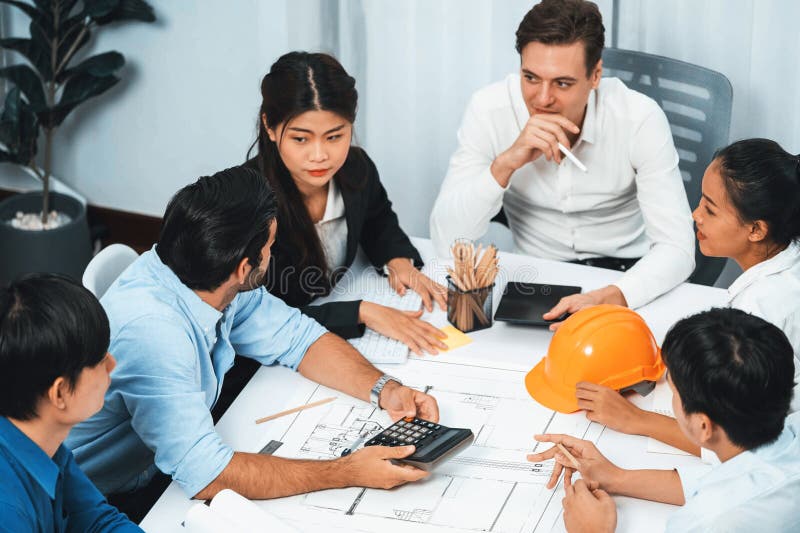 Diverse Group of Civil Engineer and Client Working on Architect ...