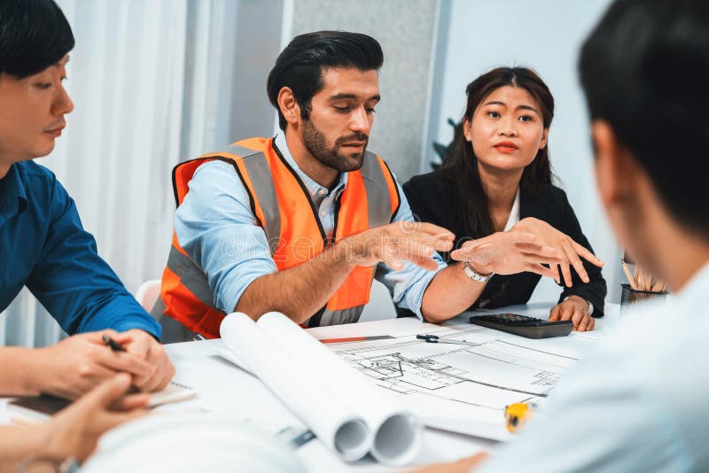 Diverse Group of Civil Engineer and Client Working on Architect ...