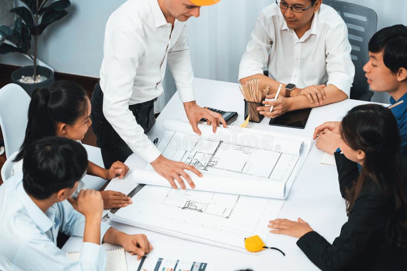 Diverse Group of Civil Engineer and Client Working on Architect ...