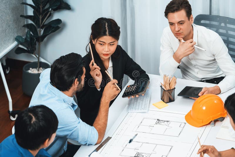 Diverse Group of Civil Engineer and Client Working on Architect ...