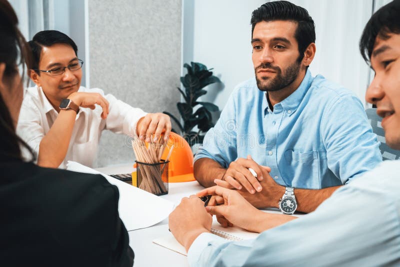 Diverse Group of Civil Engineer and Client Working on Architect ...