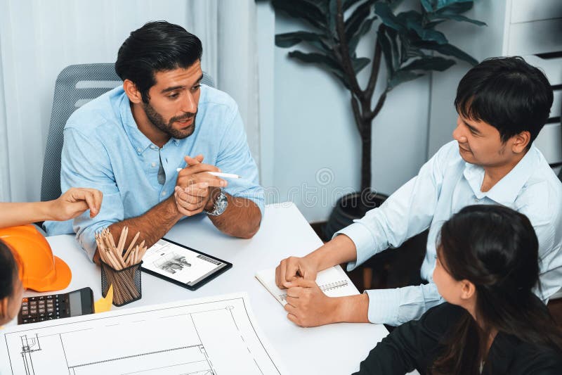 Diverse Group of Civil Engineer and Client Working on Architect ...