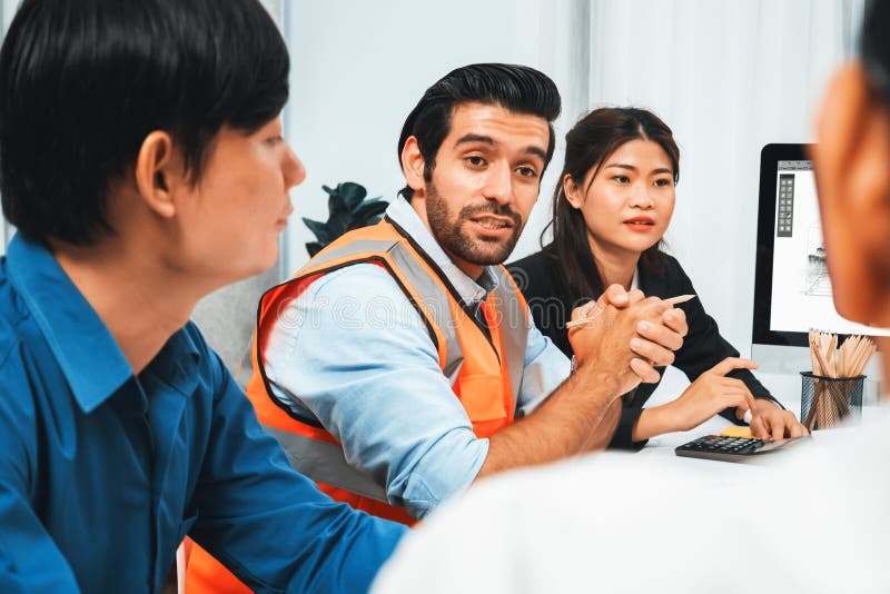 Diverse Group of Civil Engineer and Client Working on Architect ...