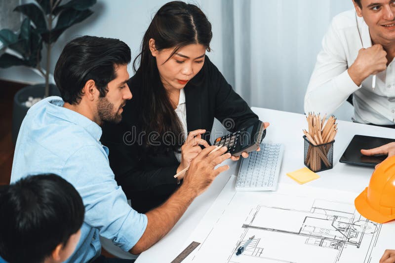 Diverse Group of Civil Engineer and Client Working on Architect ...