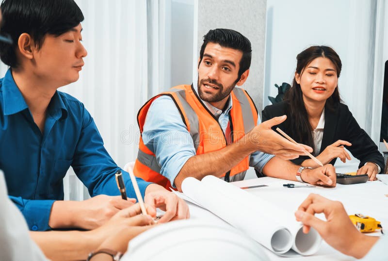 Diverse Group of Civil Engineer and Client Working on Architect ...