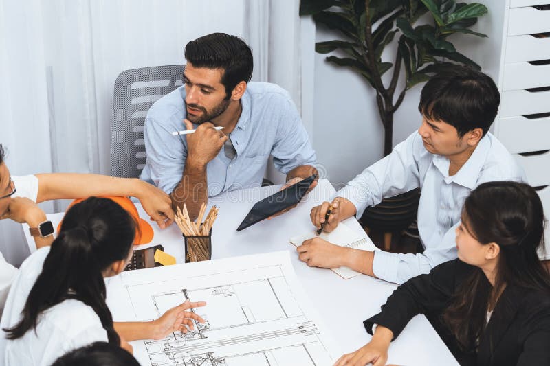 Diverse Group of Civil Engineer and Client Working on Architect ...