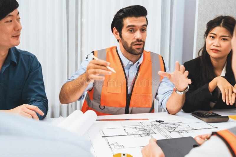 Diverse Group of Civil Engineer and Client Working on Architect ...