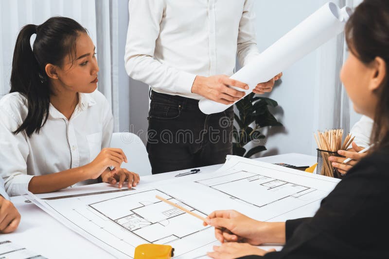 Diverse Group of Civil Engineer and Client Working on Architect ...