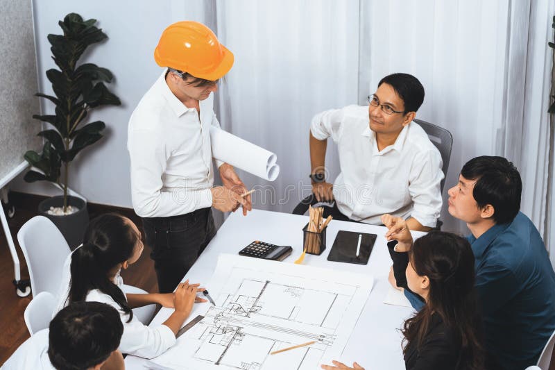 Diverse Group of Civil Engineer and Client Working on Architect ...