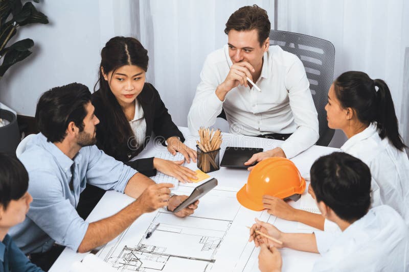 Diverse Group of Civil Engineer and Client Working on Architect ...