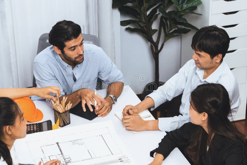 Diverse Group of Civil Engineer and Client Working on Architect ...