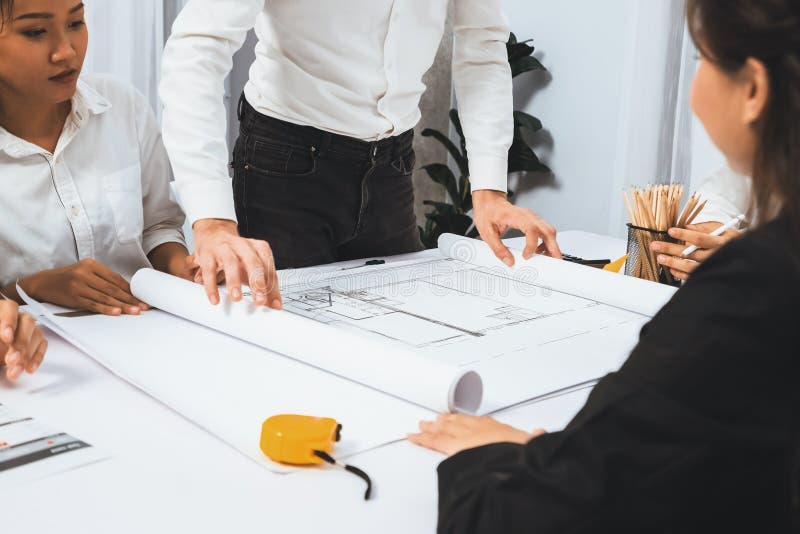 Diverse Group of Civil Engineer and Client Working on Architect ...