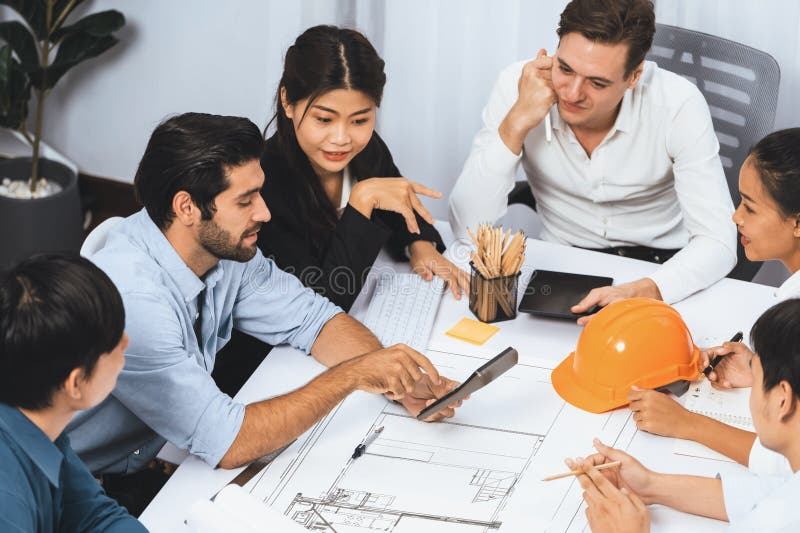Diverse Group of Civil Engineer and Client Working on Architect ...