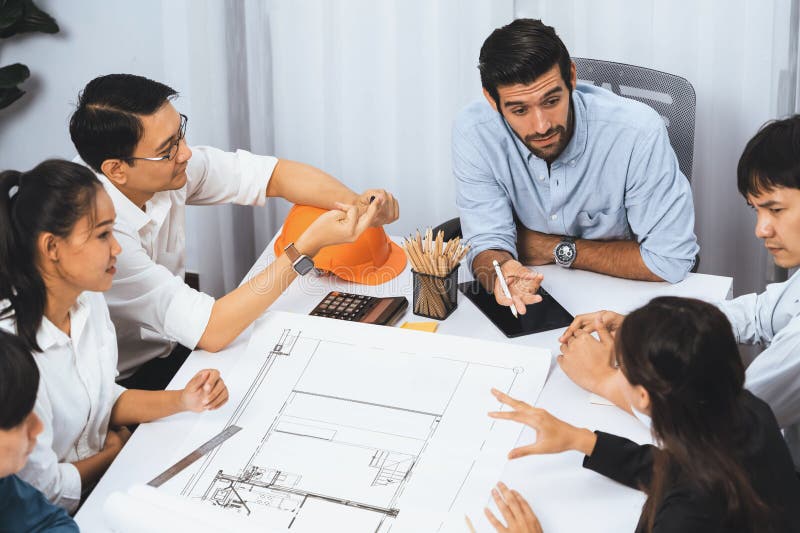 Diverse Group of Civil Engineer and Client Working on Architect ...