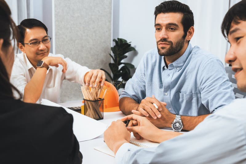 Diverse Group of Civil Engineer and Client Working on Architect ...