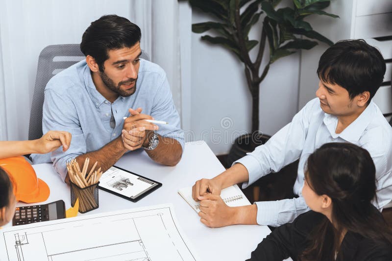 Diverse Group of Civil Engineer and Client Working on Architect ...