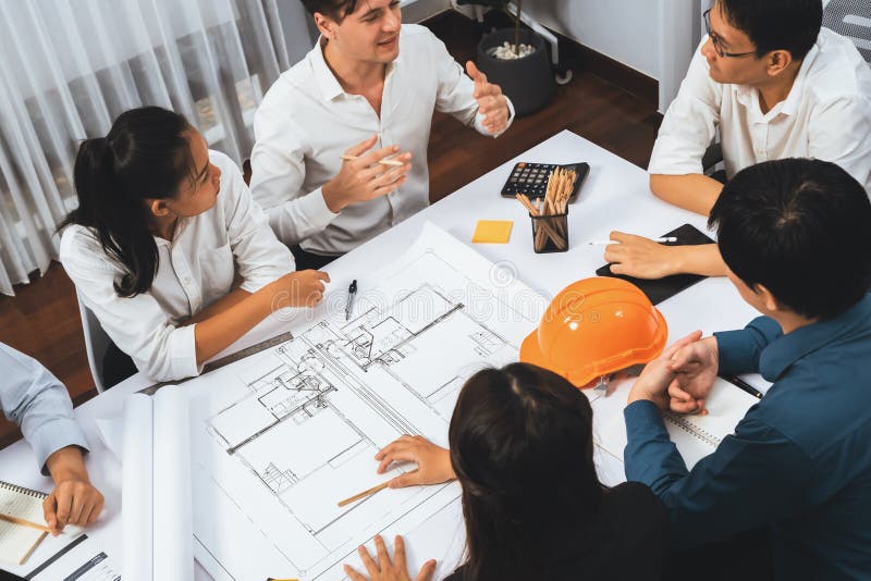 Diverse Group of Civil Engineer and Client Working on Architect ...