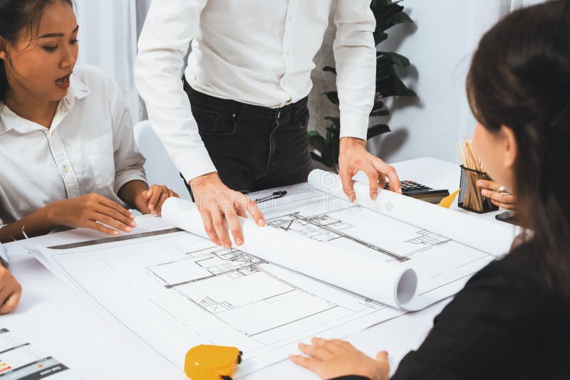 Diverse Group of Civil Engineer and Client Working on Architect ...