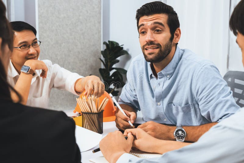 Diverse Group of Civil Engineer and Client Working on Architect ...