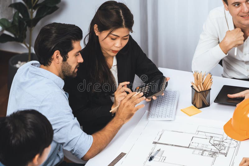 Diverse Group of Civil Engineer and Client Working on Architect ...