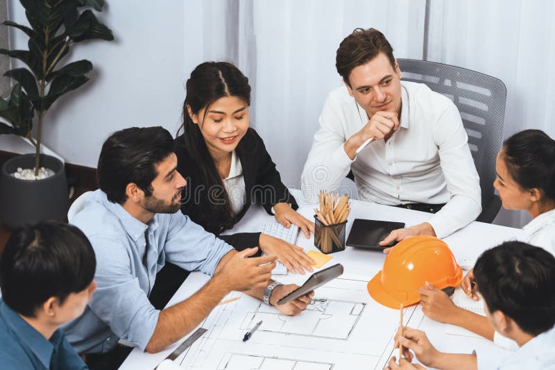 Diverse Group of Civil Engineer and Client Working on Architect ...
