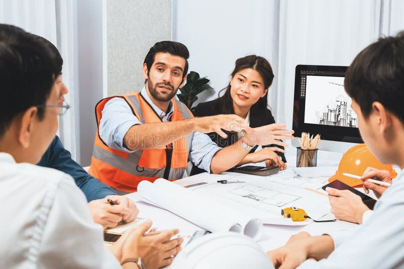 Diverse Group of Civil Engineer and Client Working on Architect ...