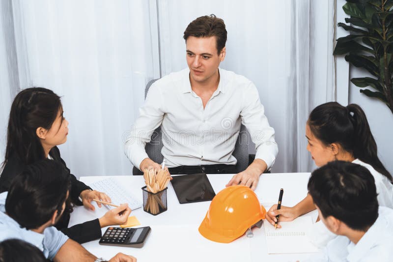 Diverse Group of Civil Engineer and Client Working on Architect ...