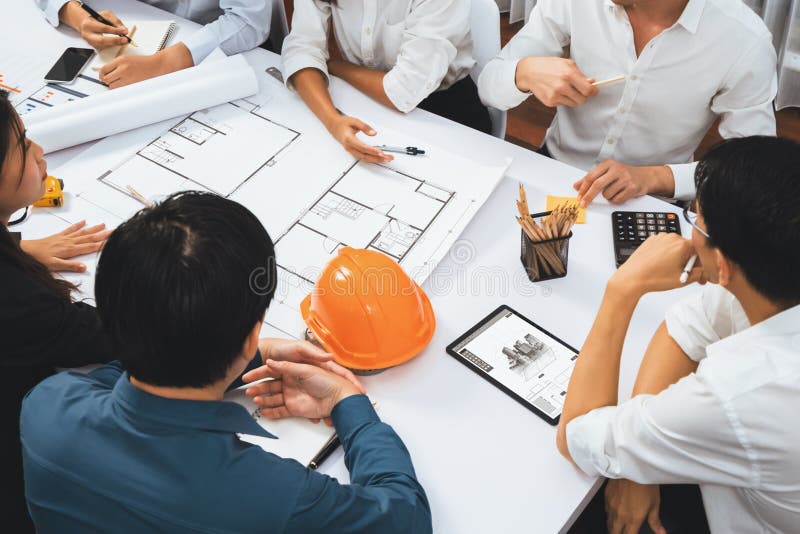 Diverse Group of Civil Engineer and Client Working on Architect ...
