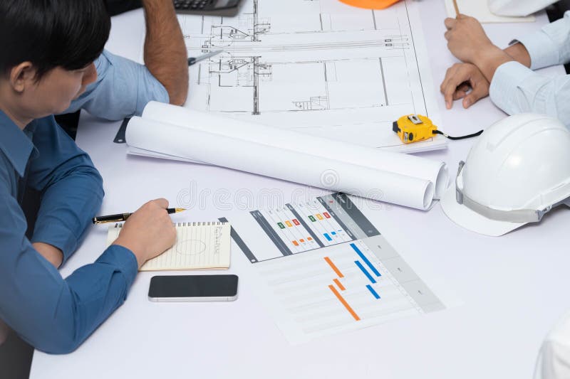 Diverse Group of Civil Engineer and Client Working on Architect ...